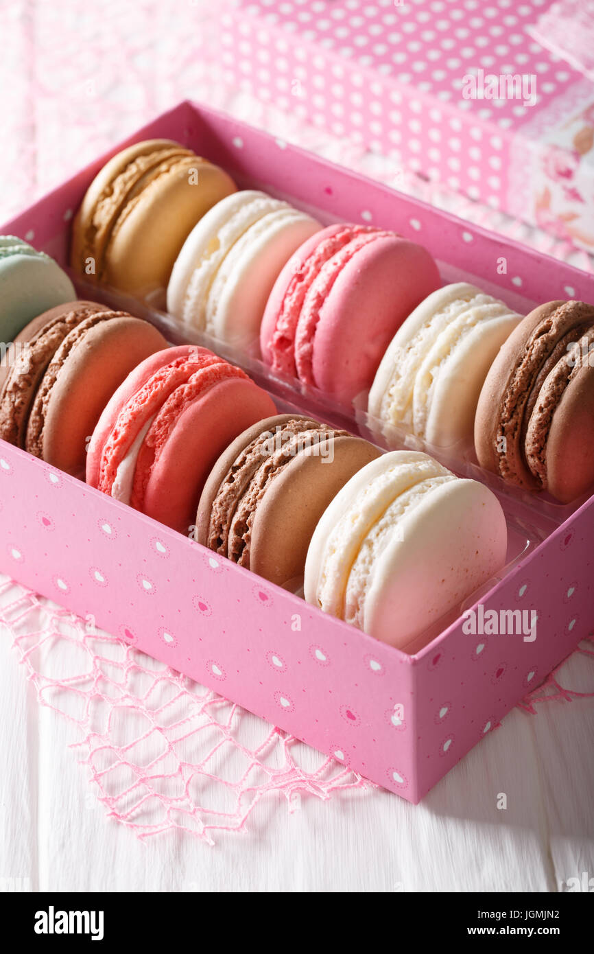 set of macaroons in a pink gift box close-up on a table. Vertical Stock ...