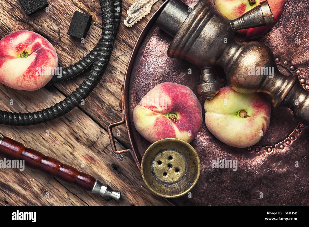 Smoking Turkish hookah with tobacco with peach flavor Stock Photo - Alamy