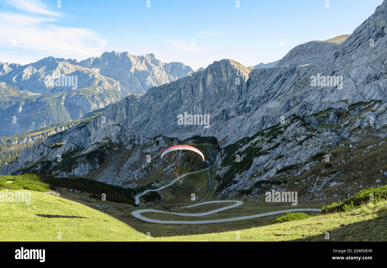 Alpine landscape with soaring paraglider in Bavarian Alps mountains ...