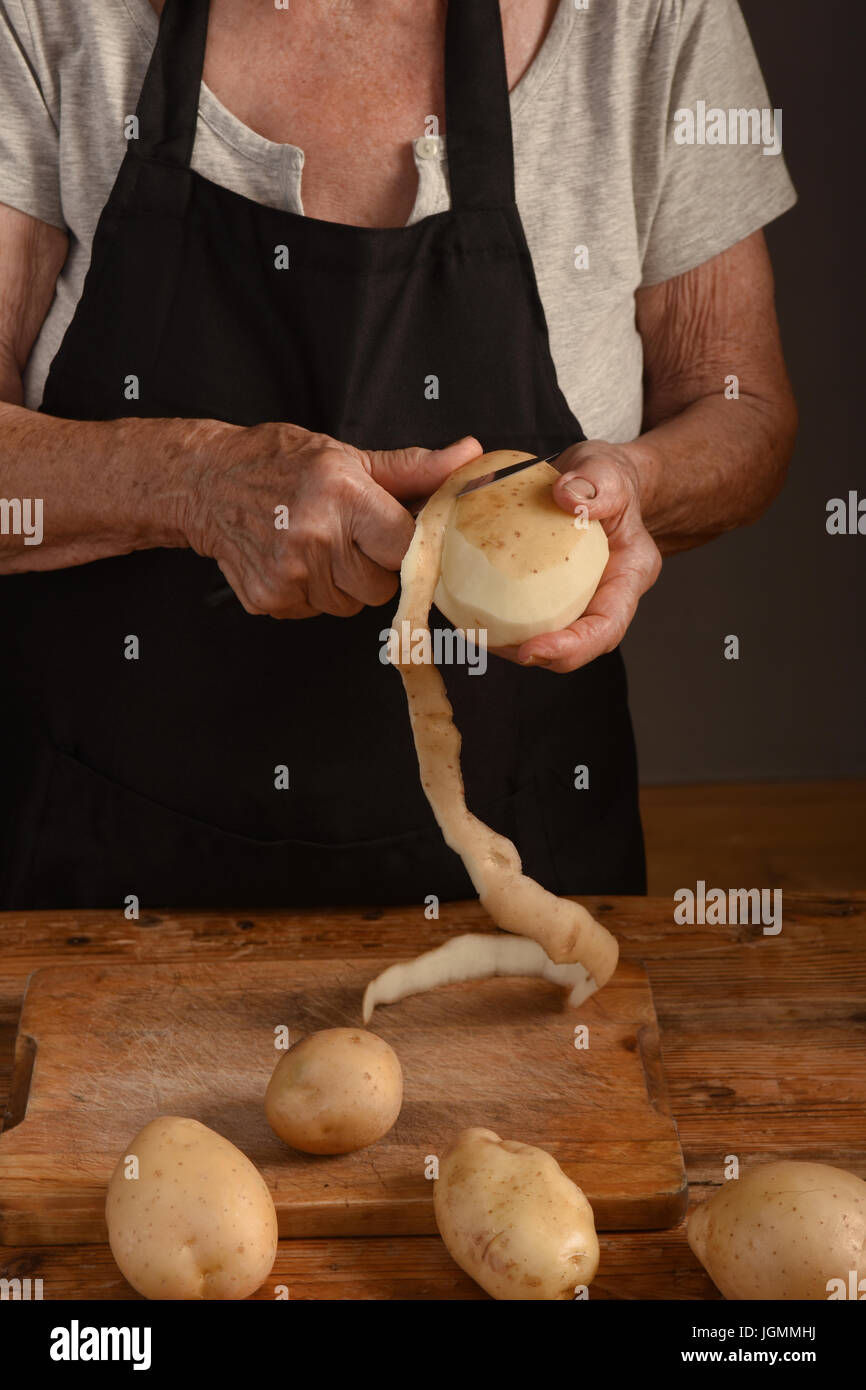 Female chef cut black bread hi-res stock photography and images - Alamy
