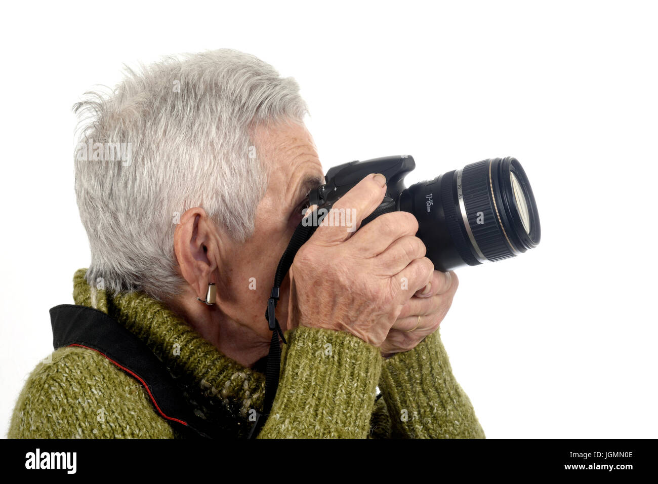Senior woman shooting with a camera reflex Stock Photo - Alamy