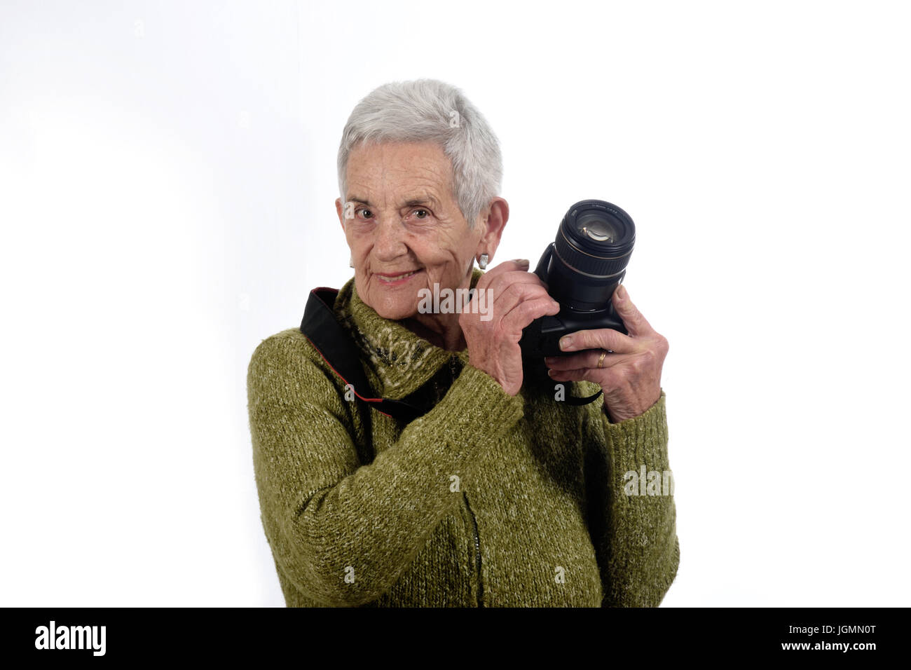 Portrait of a senior woman with SLR camera Stock Photo - Alamy