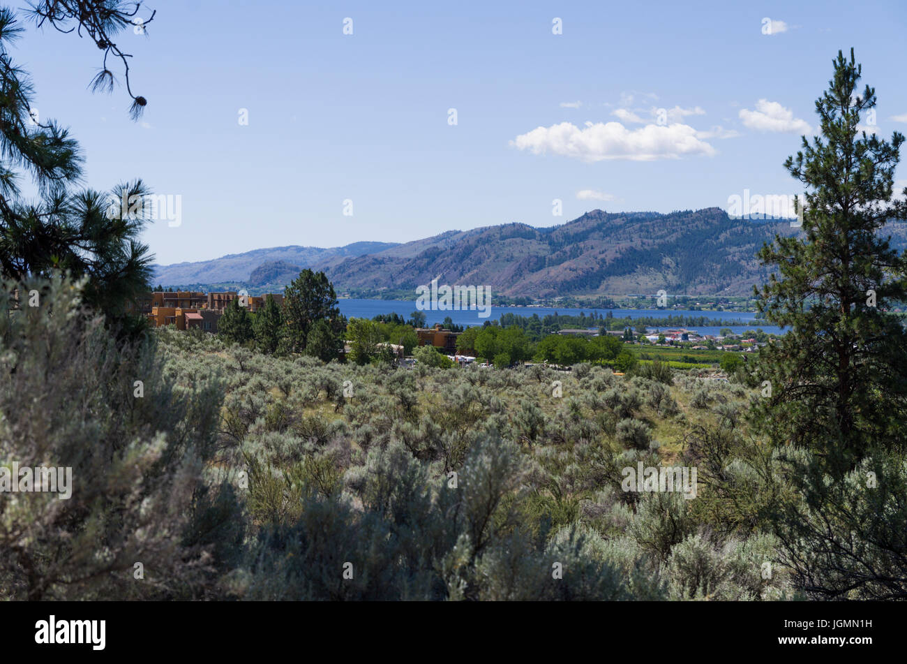 Desert landscape with Spirit Ridge resort buildings and Lake Osoyoos in ...