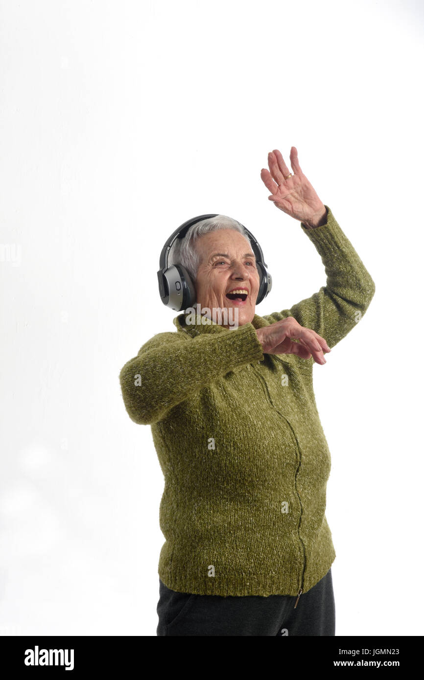 Senior woman dancing with white background Stock Photo - Alamy