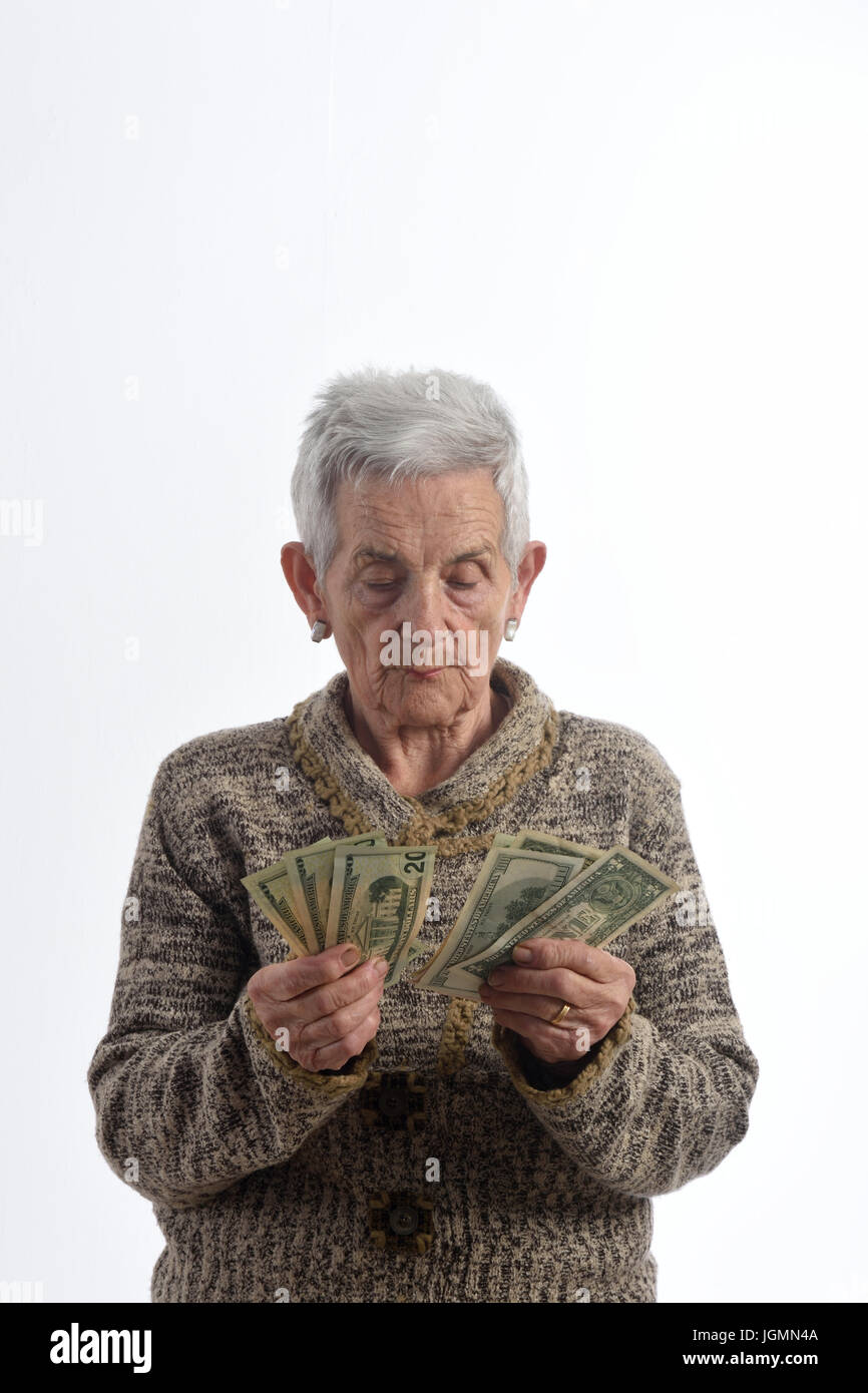 Old woman counting banknotes Stock Photo - Alamy