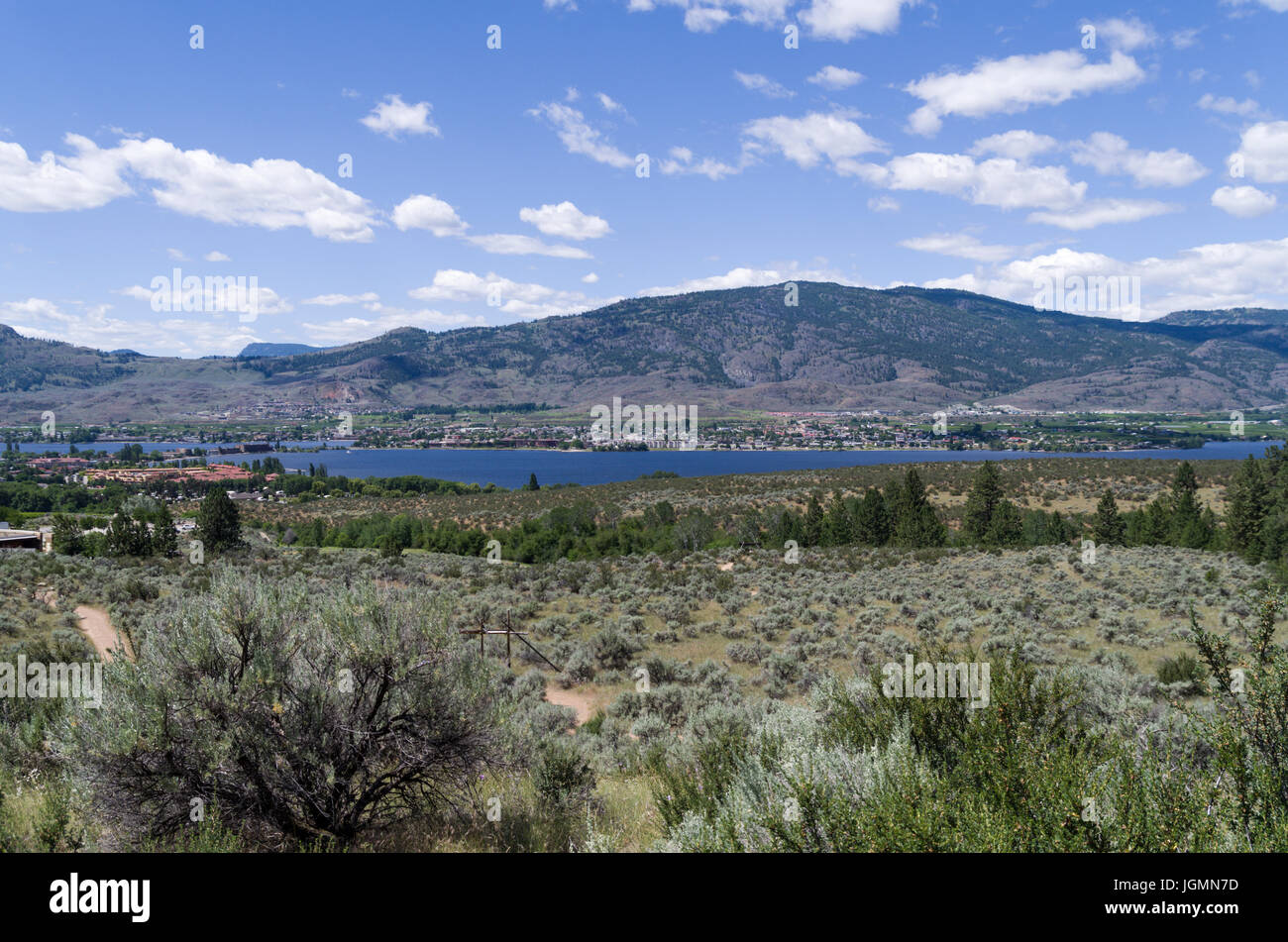 Desert landscape with Spirit Ridge resort buildings and Lake Osoyoos in ...