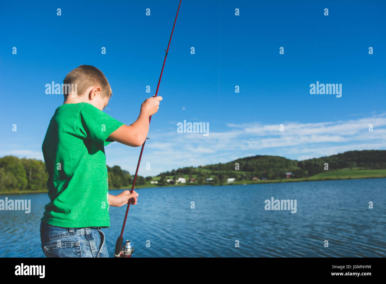 Child holding fishing pole hi-res stock photography and images - Alamy