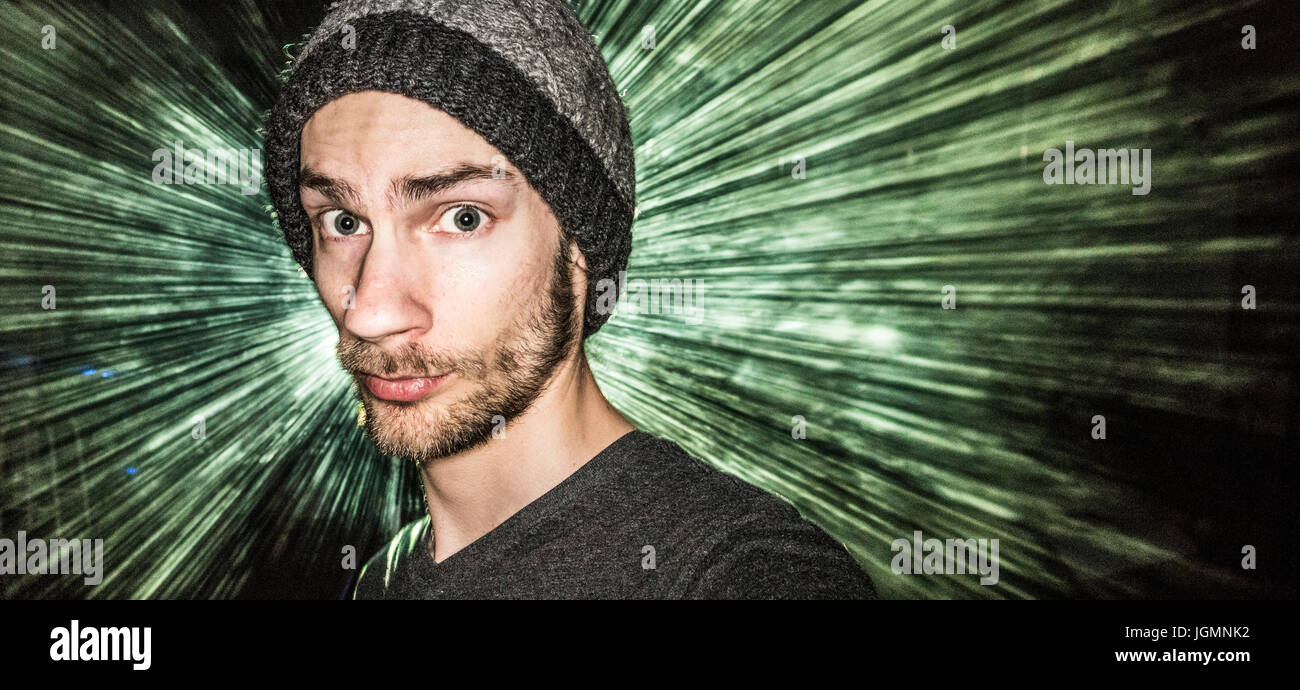 Single person dancing at rave concert with laser lights Stock Photo - Alamy