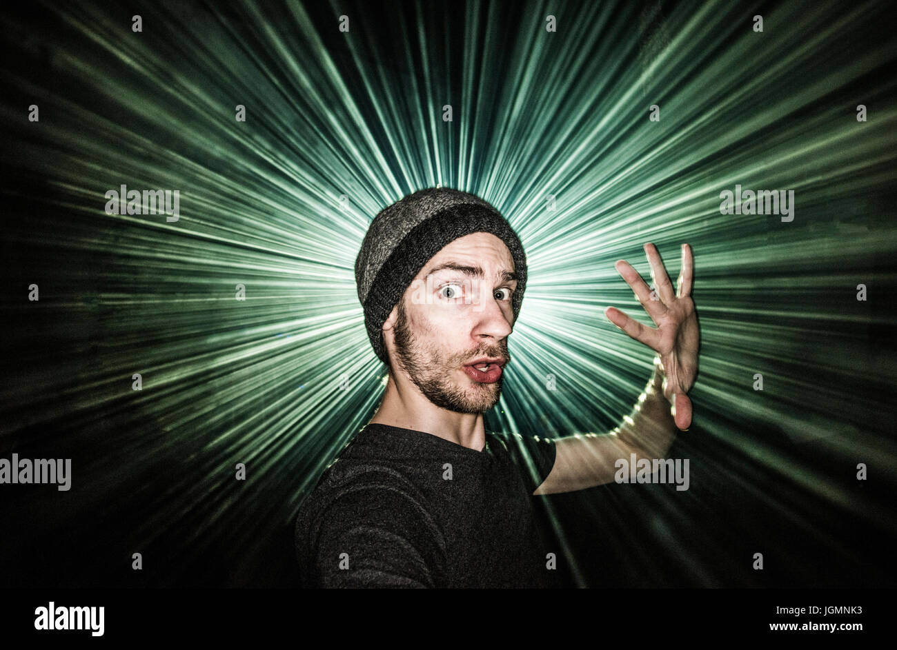 Single person dancing at rave concert with laser lights Stock Photo - Alamy