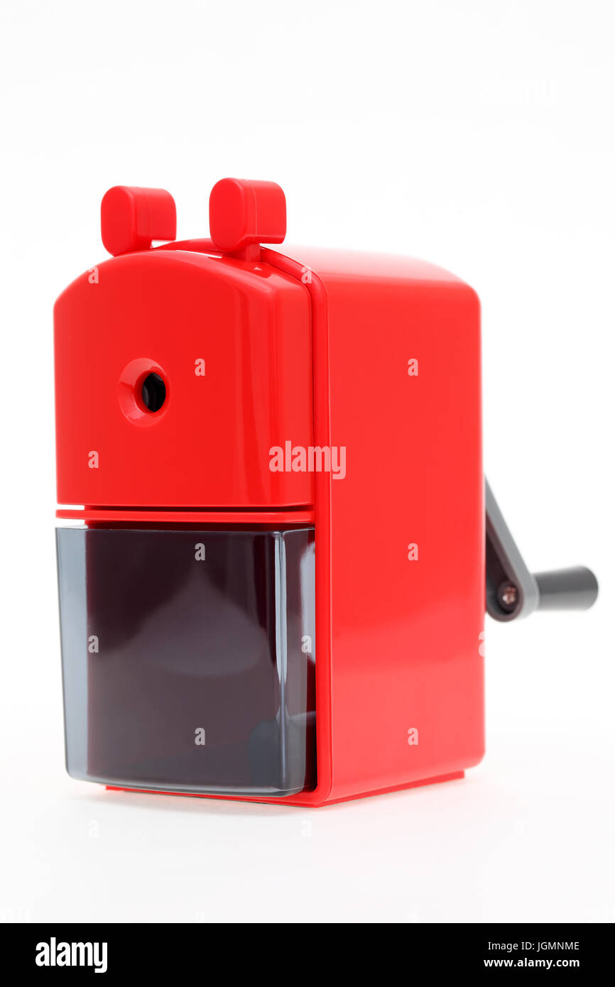 Red plastic pencil sharpener on white background Stock Photo - Alamy