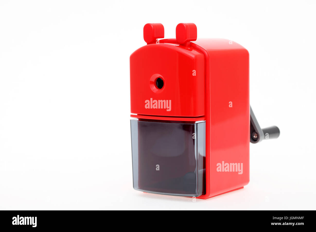 Red plastic pencil sharpener on white background Stock Photo - Alamy