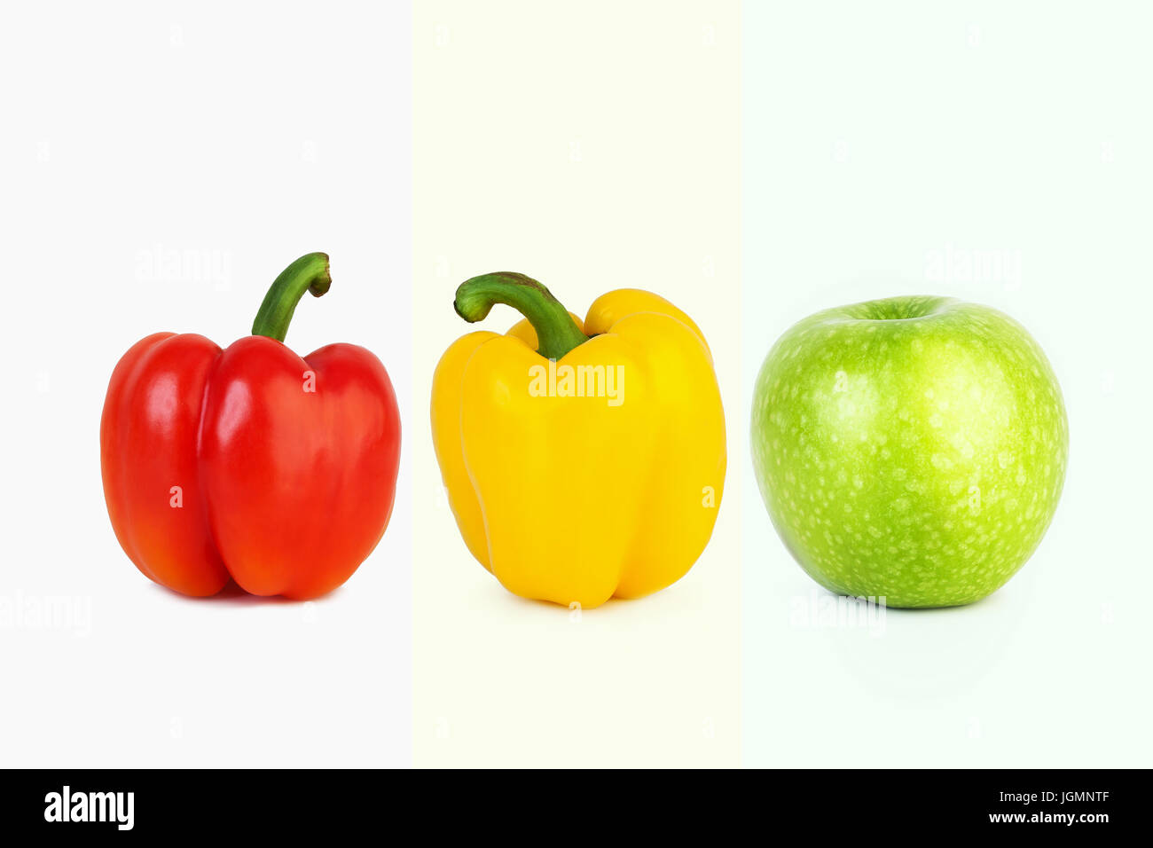 Fresh big red and yellow peppers and big green apple on white isolated ...