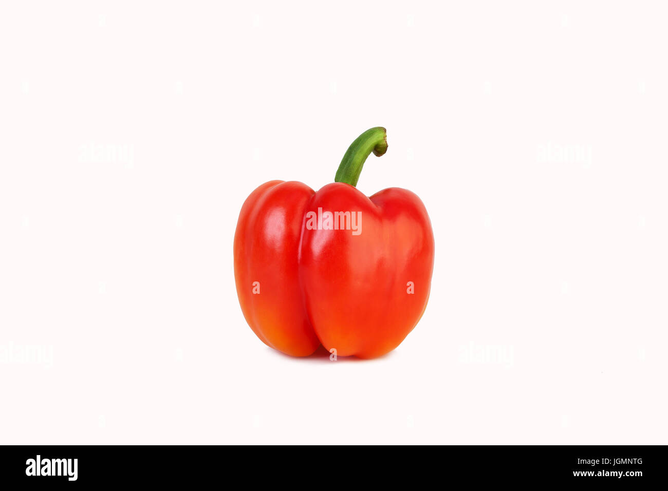Fresh big red pepper on white isolated background in the middle Stock ...
