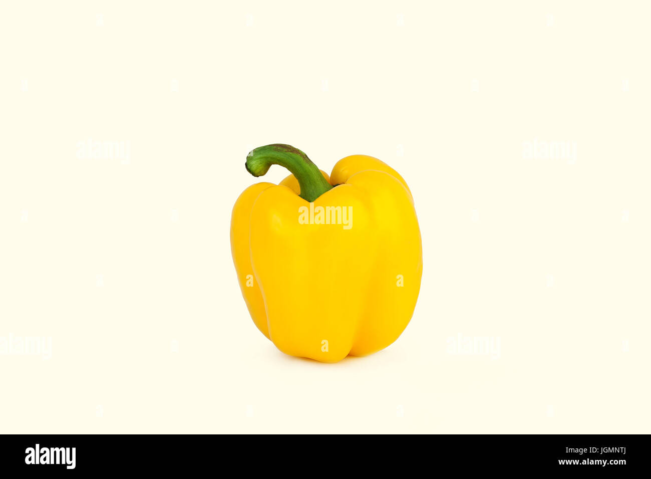 Fresh large yellow pepper on white isolated background in the middle ...