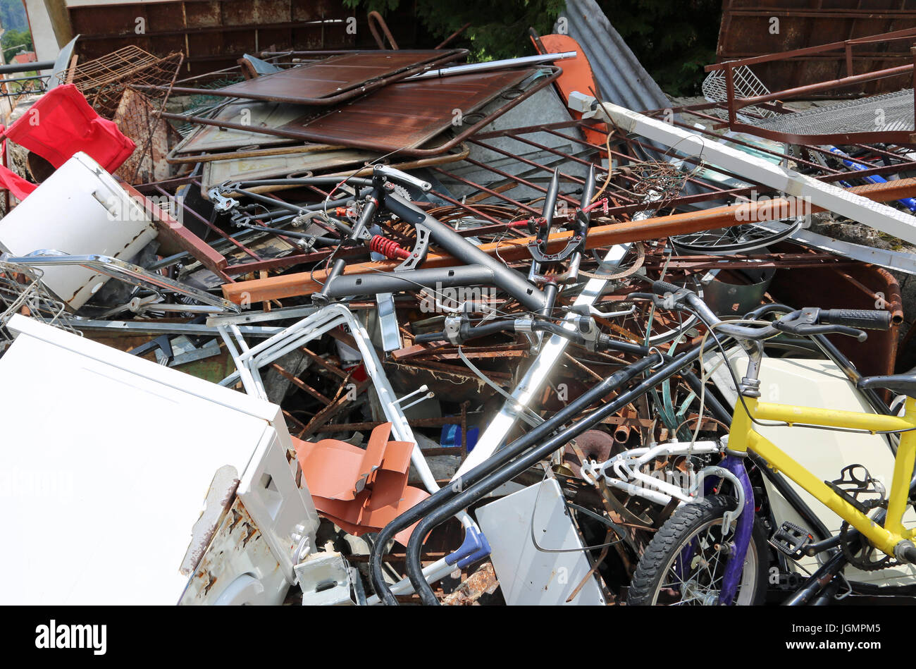 background of dump of ferrous material with many rusty and unusable ...