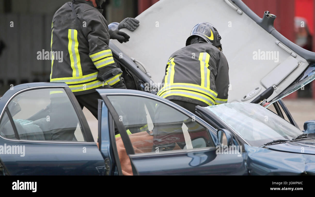 Firefighter team takes off the car roof to pull the wound after the car ...