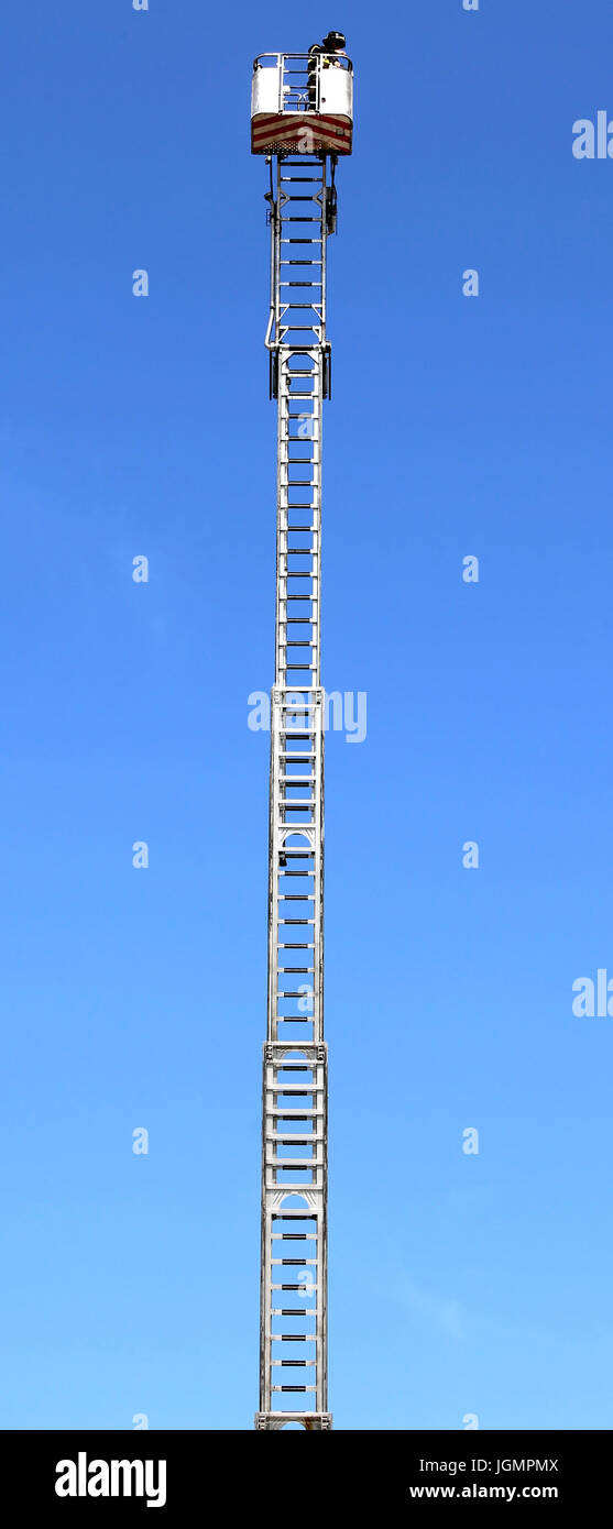 fireman over the long staircase with metallic basket controls during a ...