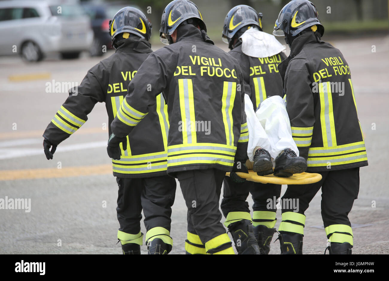 Italian firefighter team uniform with firefighters writing while ...