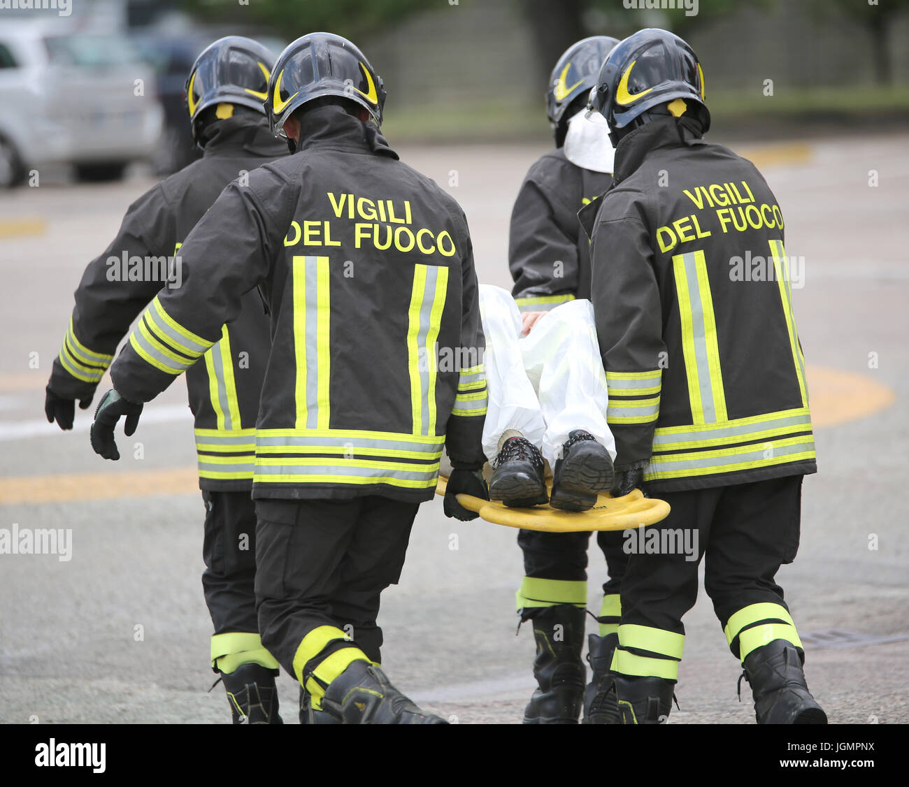 Italian firefighter team uniform with firefighters writing while ...