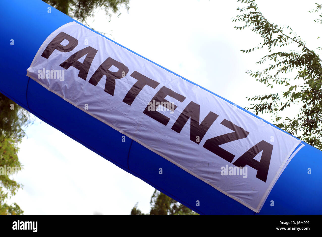 Large inflatable portal with the Italian Written PARTENZA which means ...