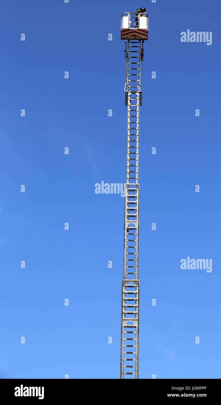 Long staircase with metallic basket during fire fighting exercises and ...