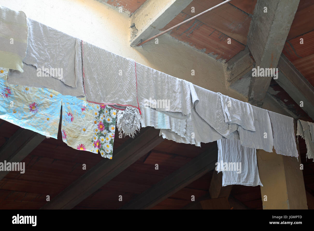 wet Rags and canovars hung to dry in the attic of the house Stock Photo ...