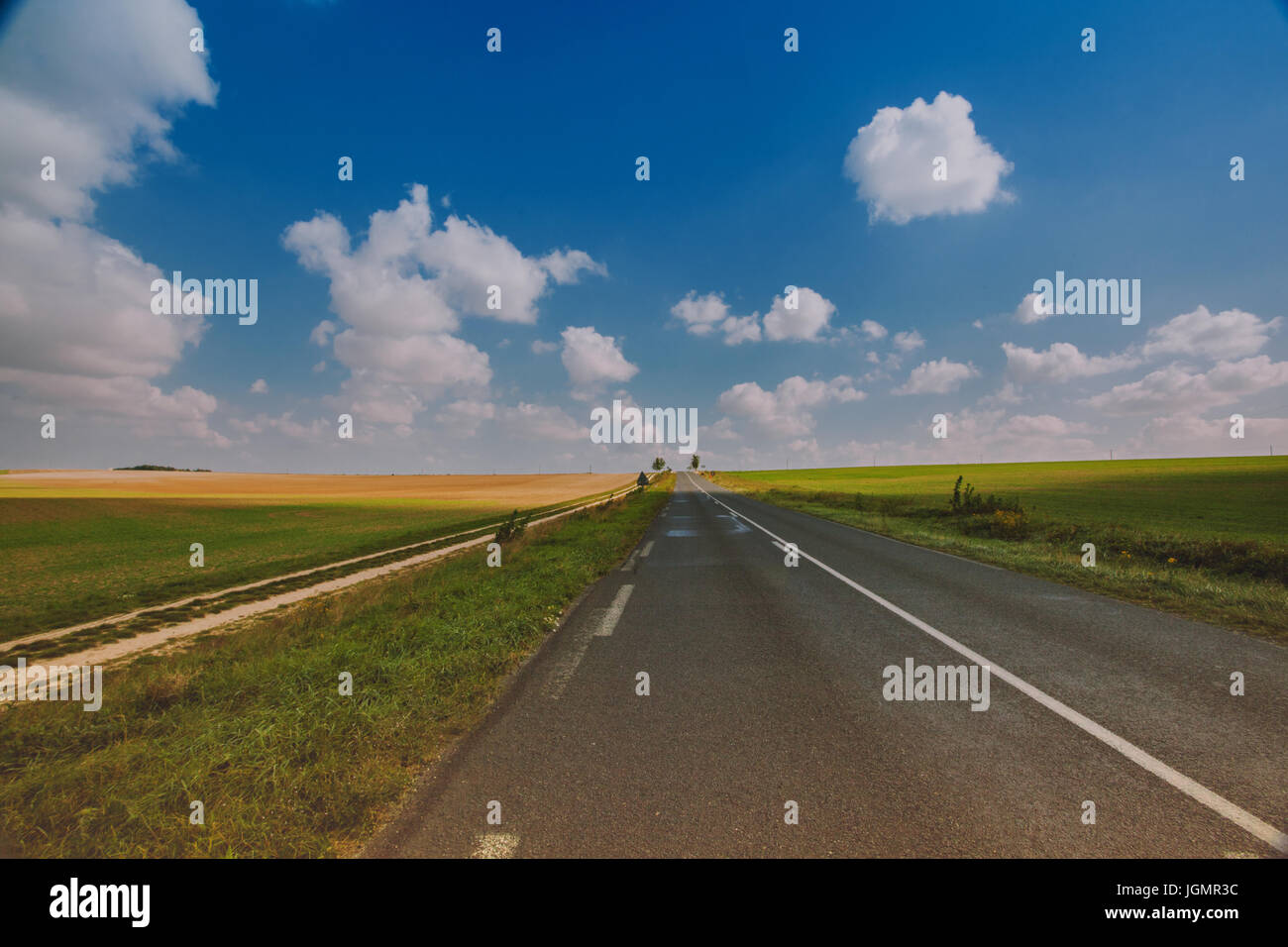 The endless mile. A road somewhere in the middle of the French ...