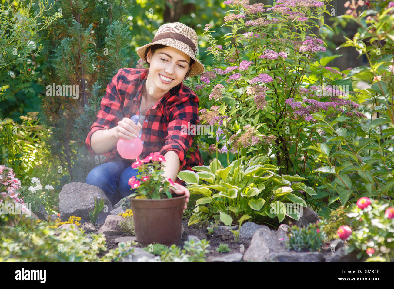Spraying water on plants hi-res stock photography and images - Alamy