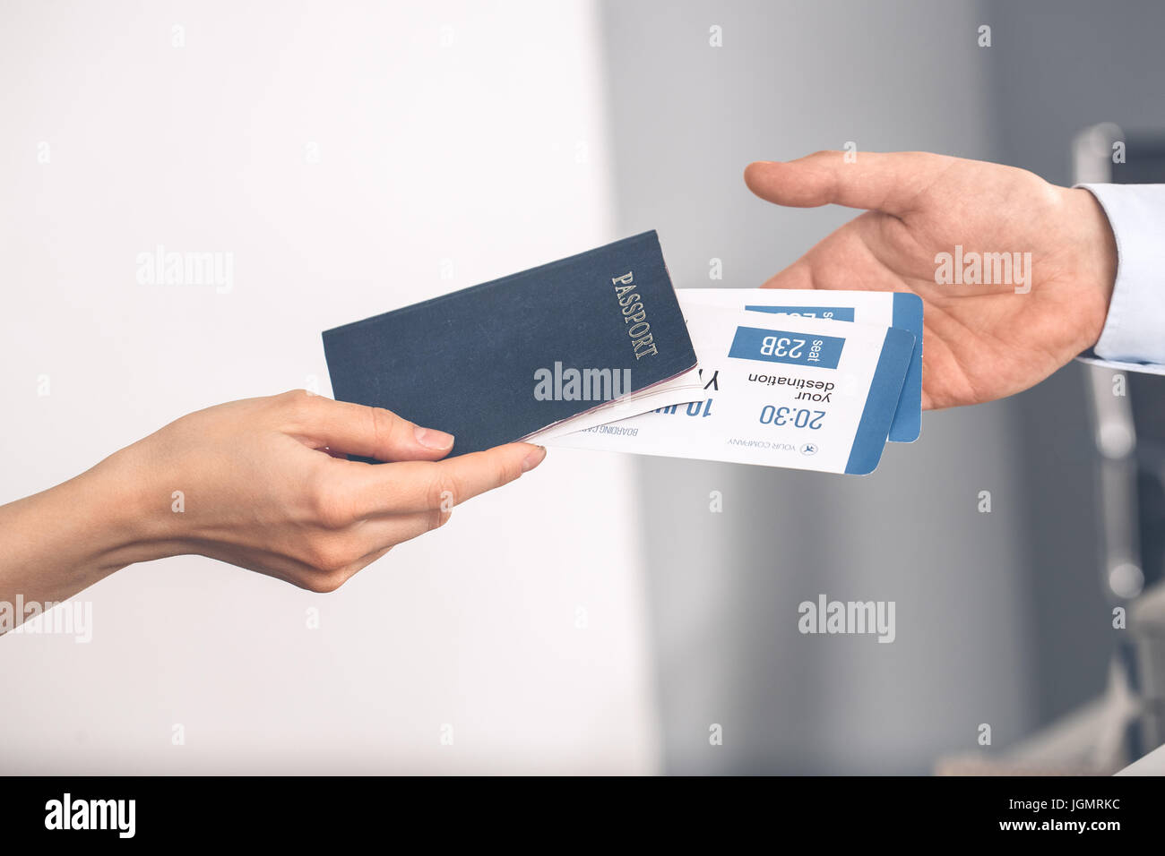 Young female and male in the company office getting flight tickets ...