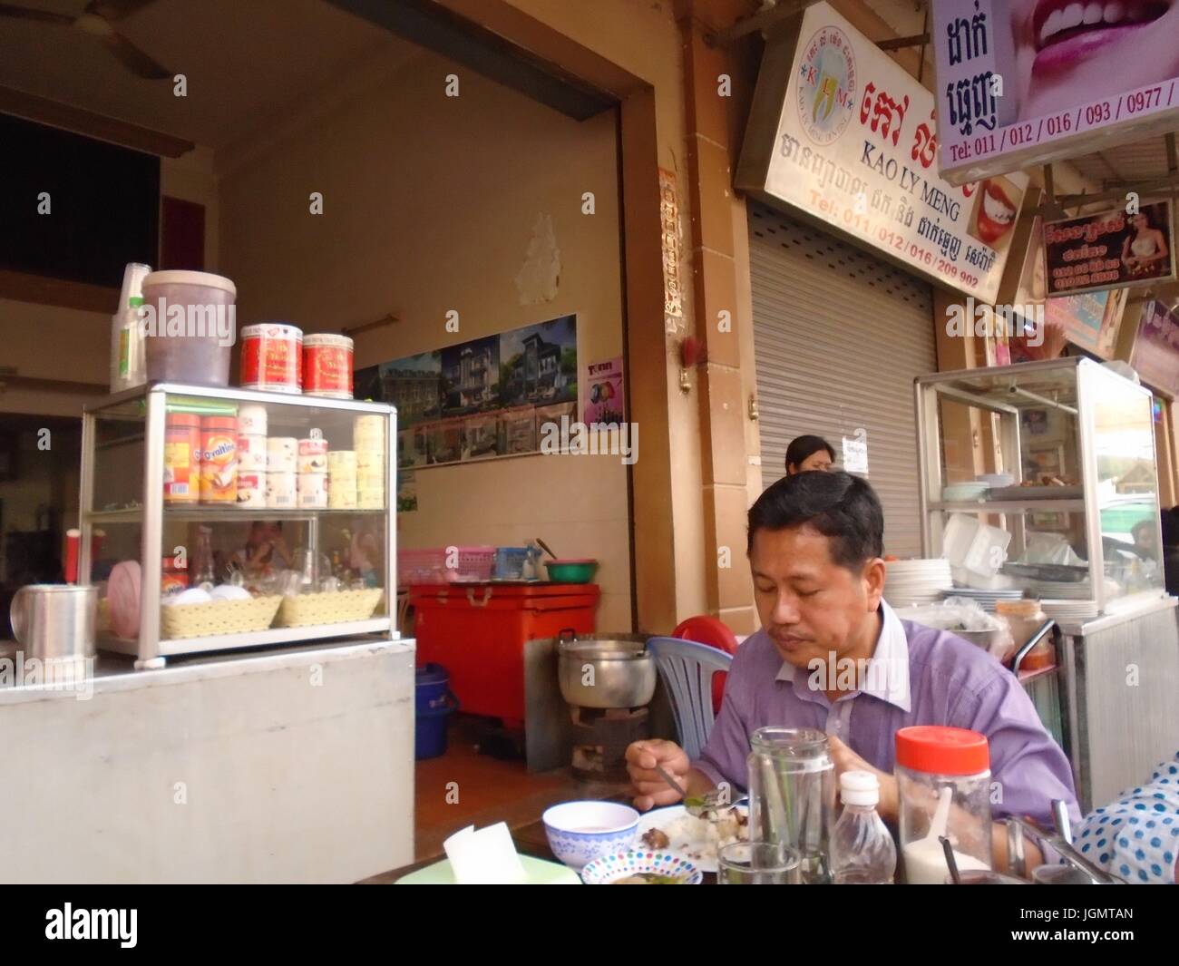 Man Eating at a Outdoor Open Air Restaurant in Poipet Cambodia Banteay ...