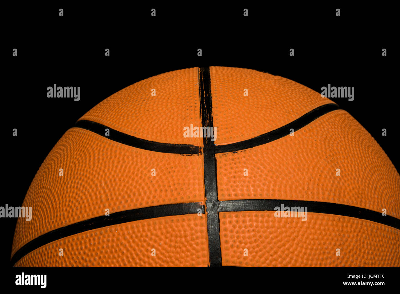 A single basketball isolated on a black background Stock Photo - Alamy