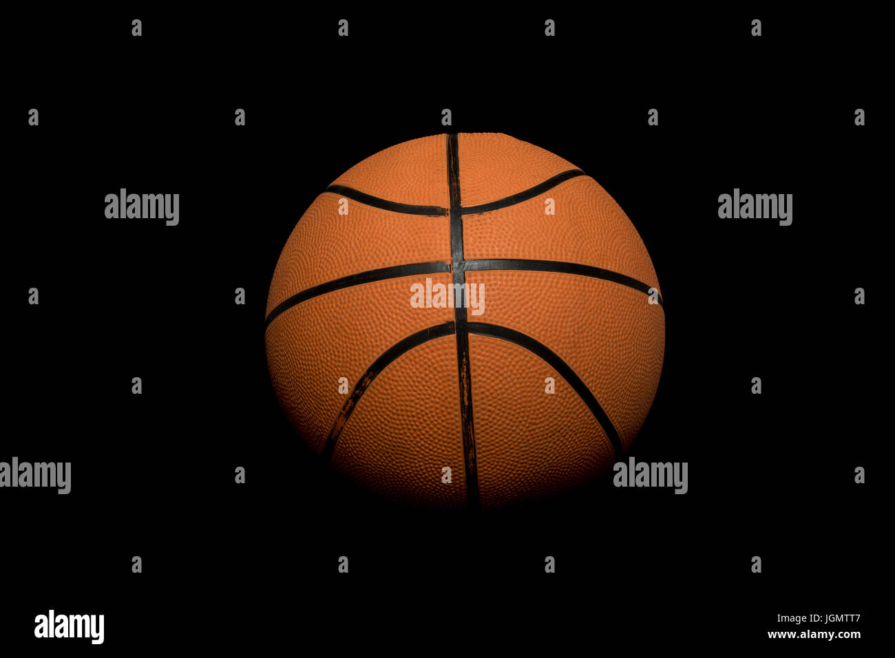 A single basketball isolated on a black background Stock Photo - Alamy
