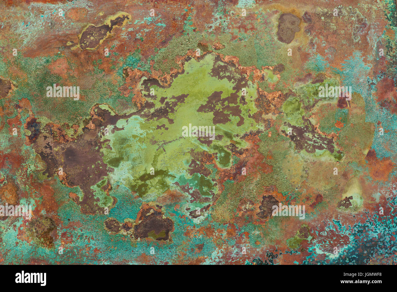 Aged copper plate texture with green patina stains. Old worn metal ...