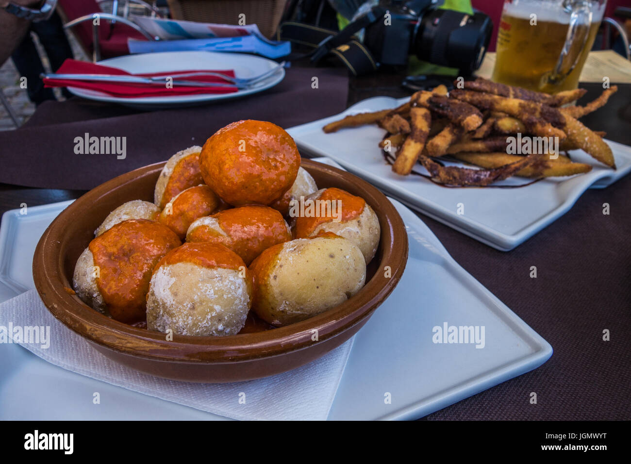 Wrinkly potatoes with red mojo Stock Photo - Alamy