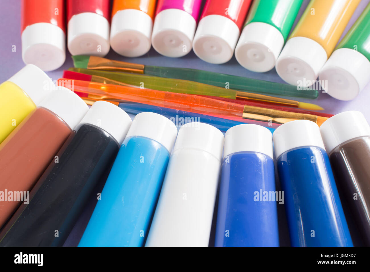 Multicolored rainbow acrylic paints tubes set with five colorful ...