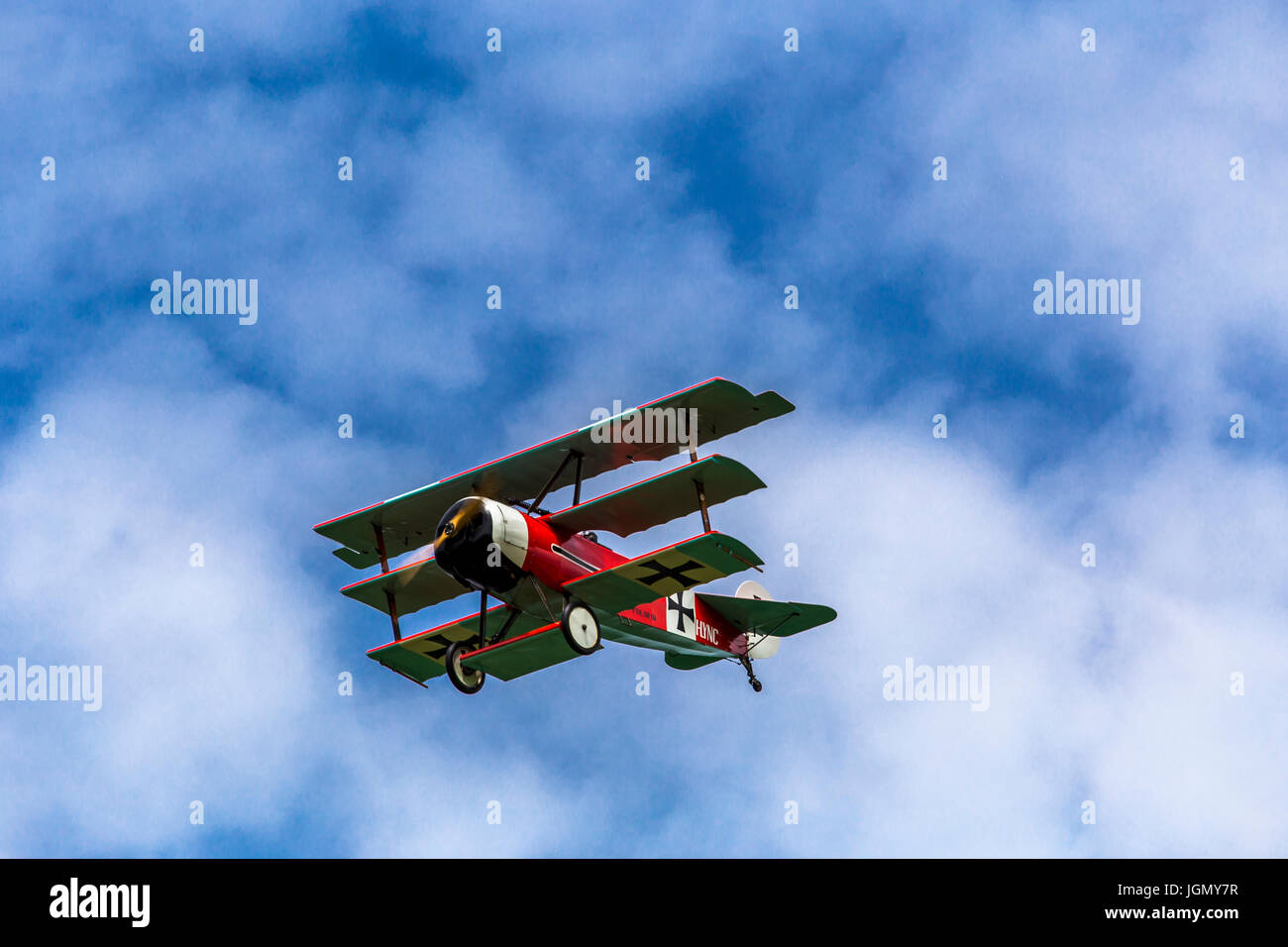 Flying military german triplane Fokker Dr-1 M replica between the ...