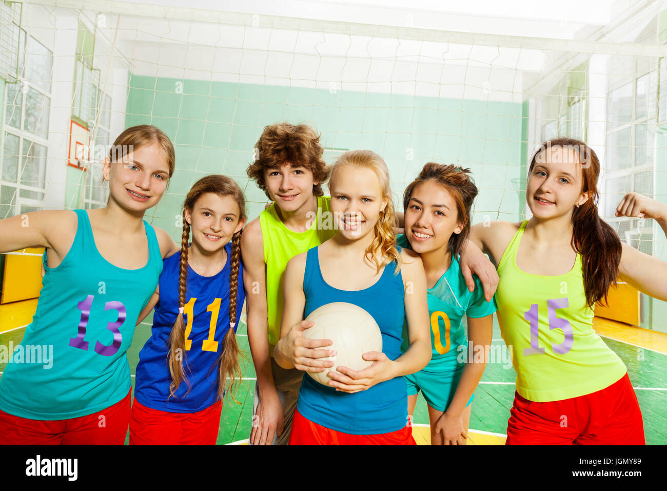 Happy volleyball players celebrating a victory Stock Photo - Alamy