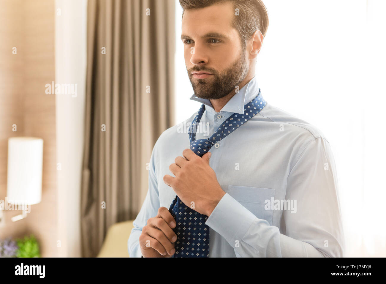 Young man business traveler hotel room accomodation Stock Photo - Alamy