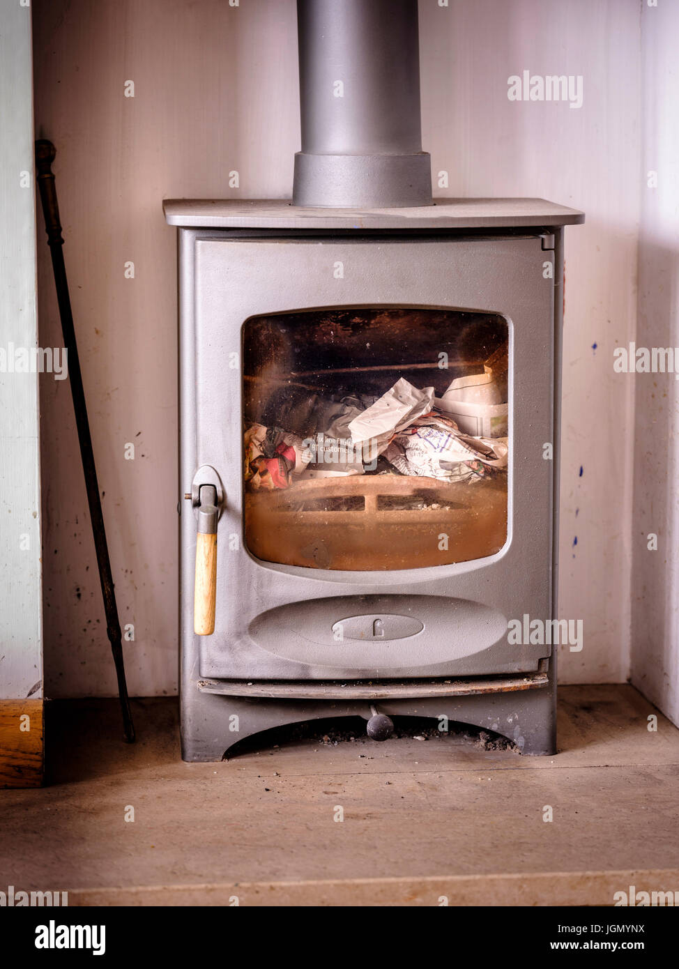 A silver woodburning stove primed and ready to light Stock Photo - Alamy