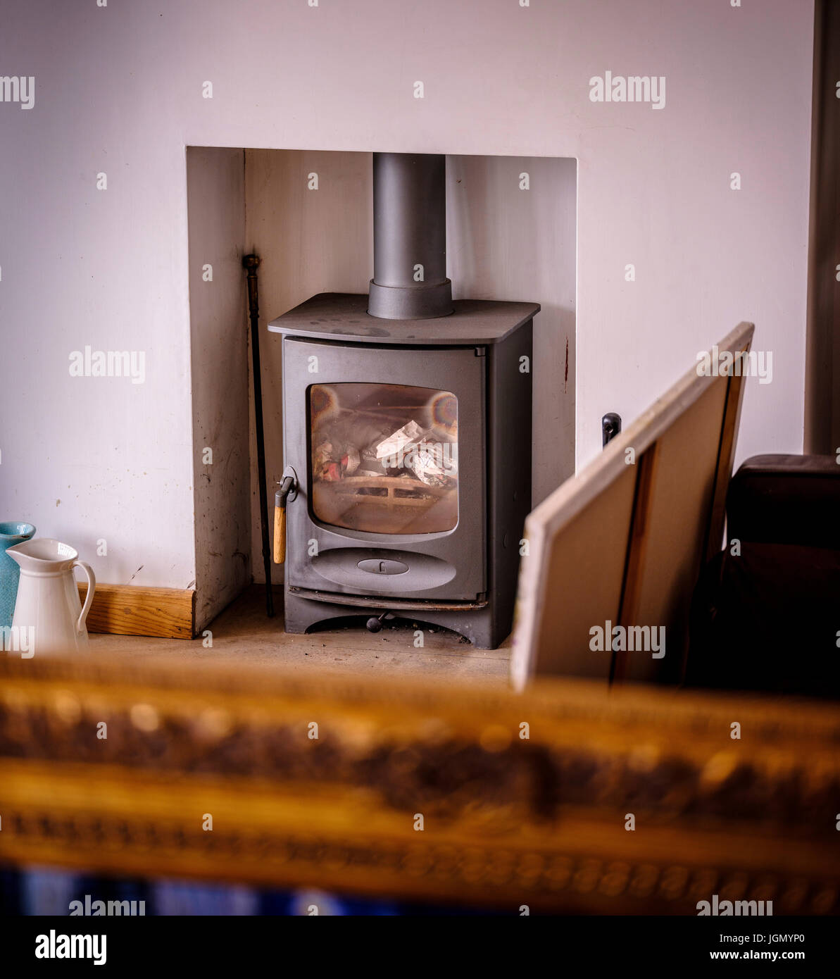 A silver woodburning stove primed and ready to light Stock Photo - Alamy