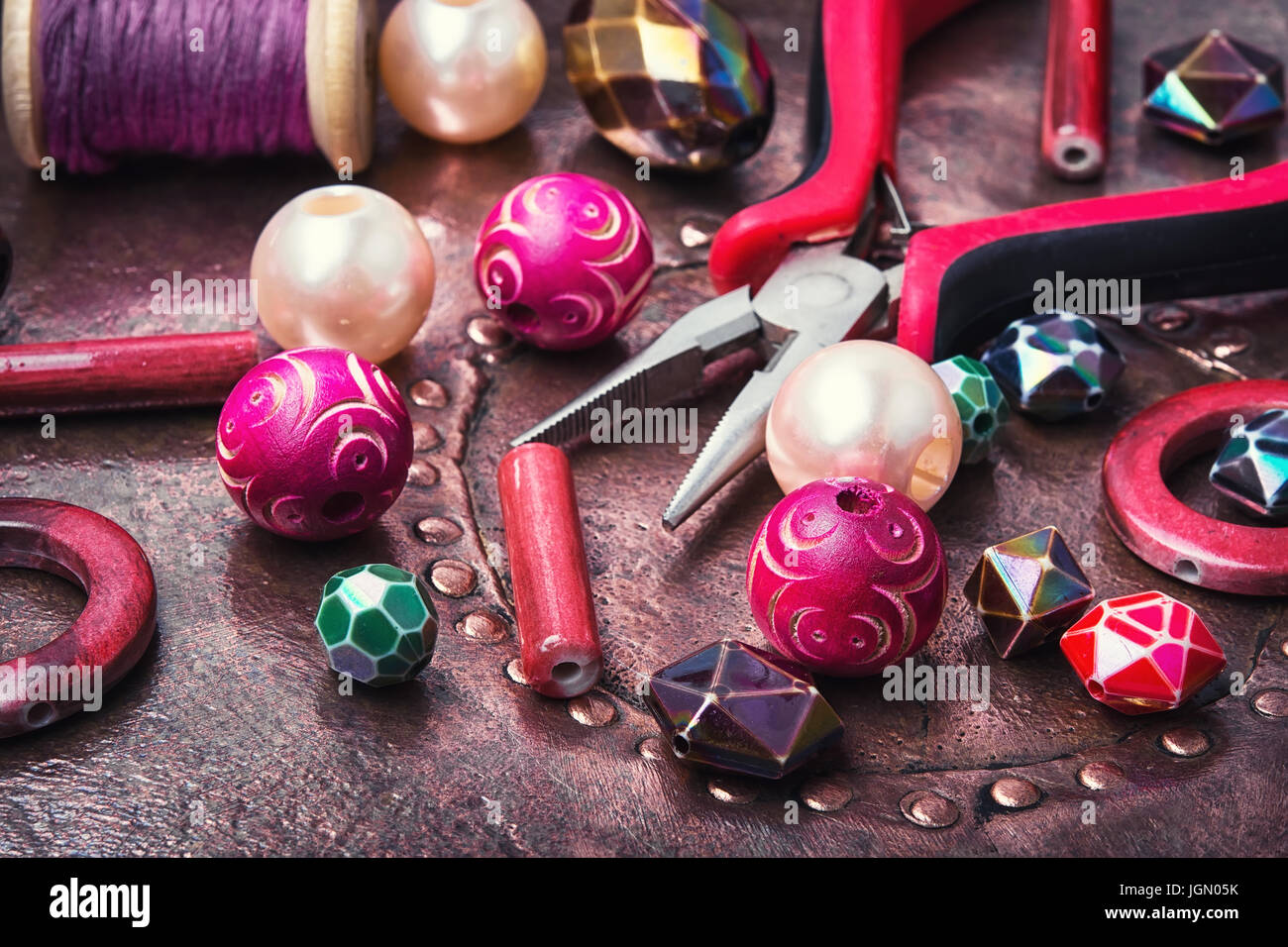 Making of handmade jewellery from colorful beads.Colorful bead heap ...