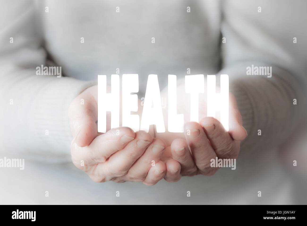 Woman's hands holding HEALTH Stock Photo - Alamy