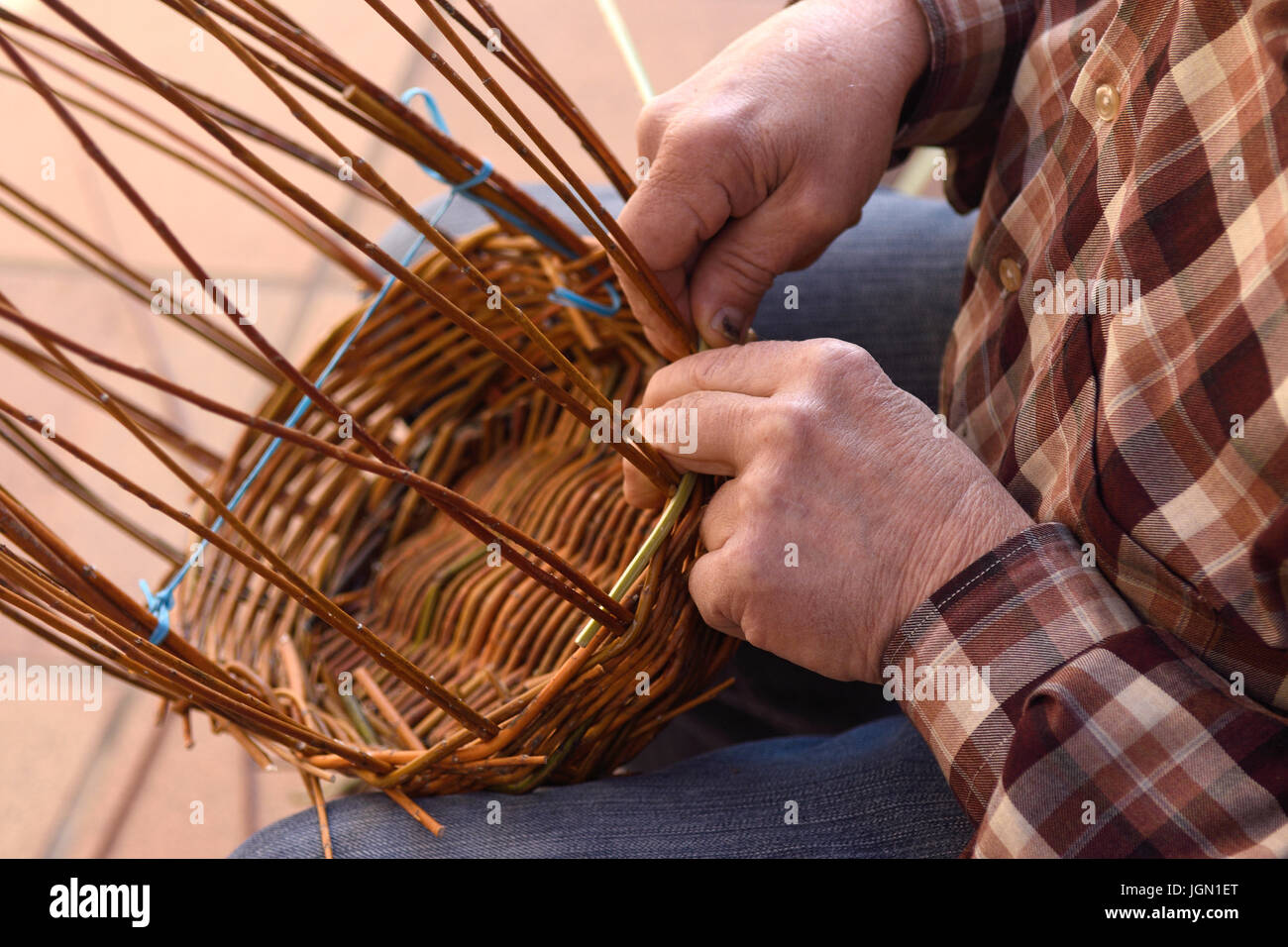 craftsman making wicker basket Stock Photo - Alamy