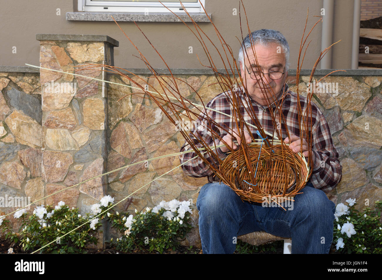 craftsman making wicker basket Stock Photo - Alamy