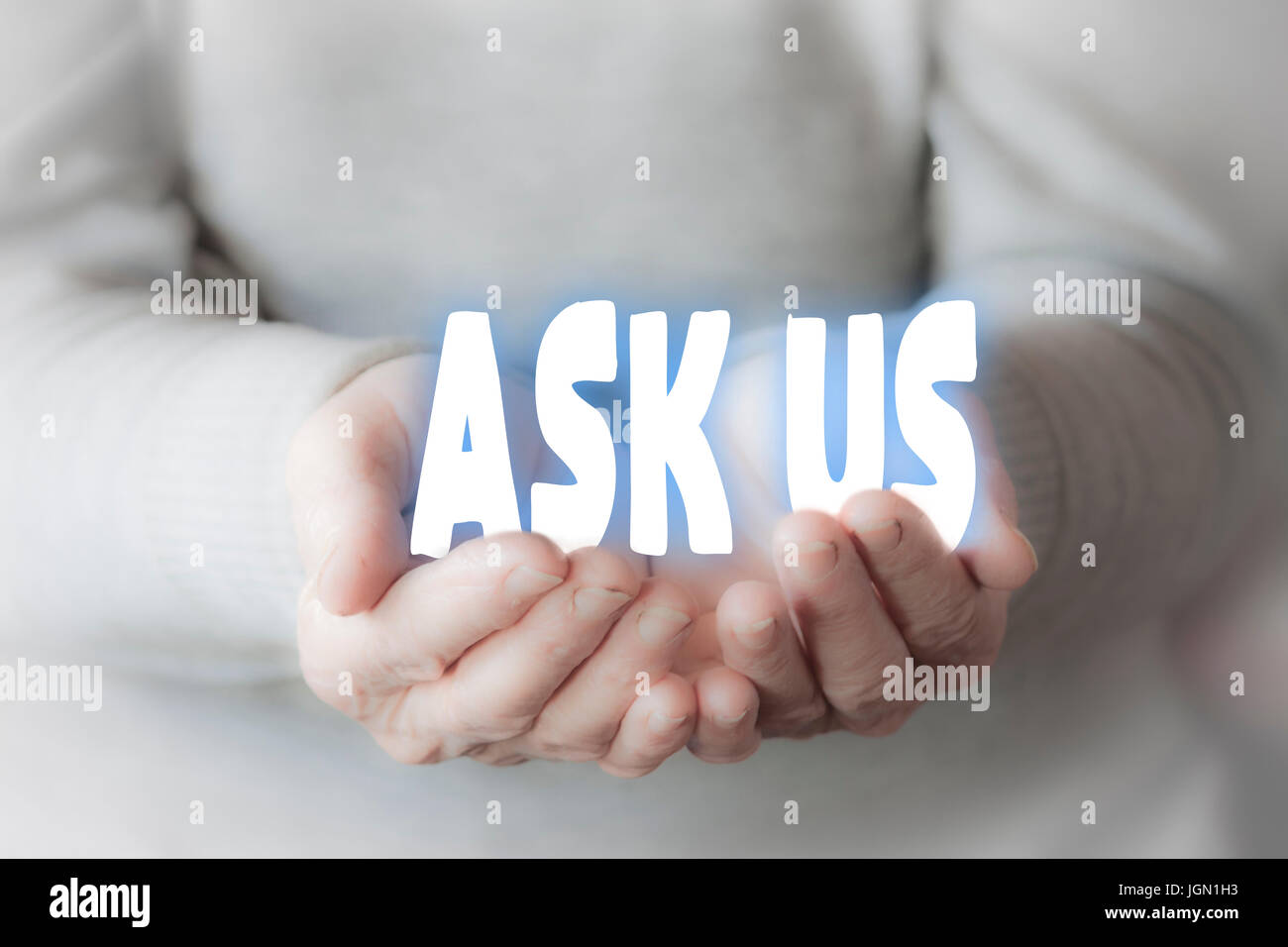 Hands of a woman holding the write ASK US Stock Photo - Alamy