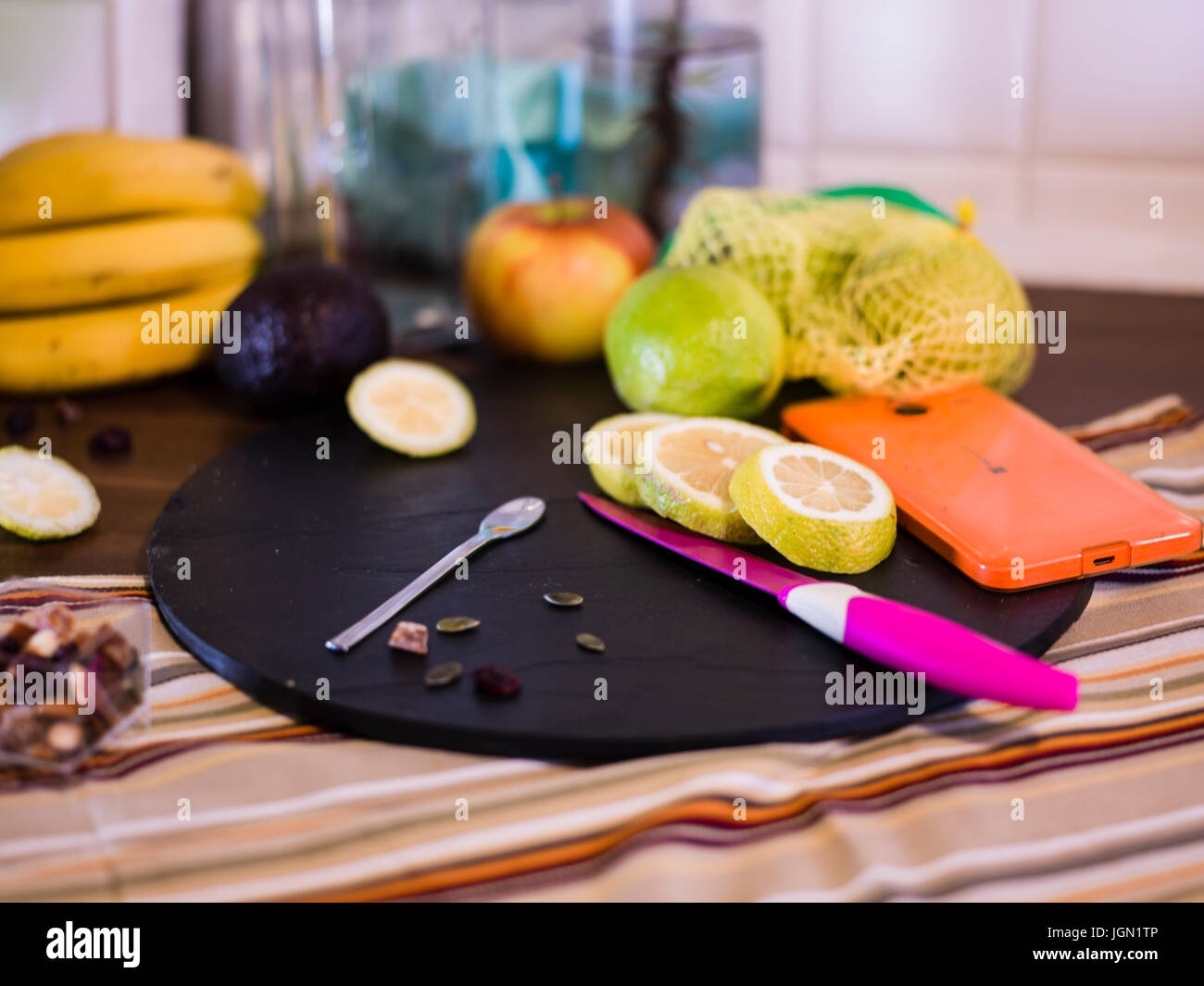 Small design jar with straw filled with infused water of lemon, straw ...