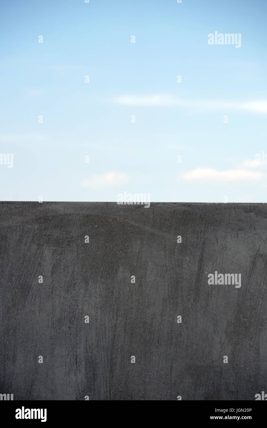 A homogeneous and modern gray wall edge against a blue sky Stock Photo ...