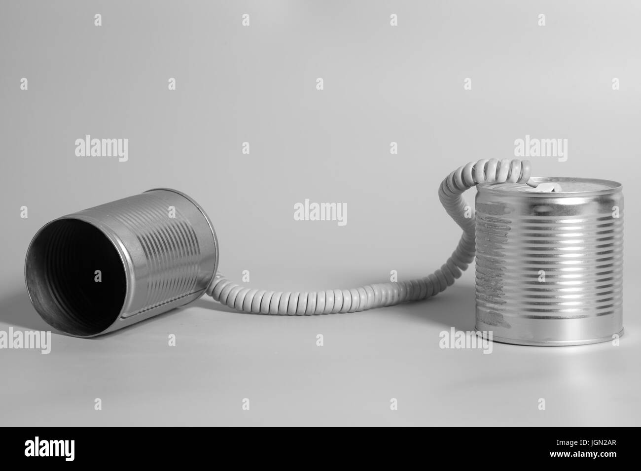Tin can phone. Communication concept Stock Photo - Alamy