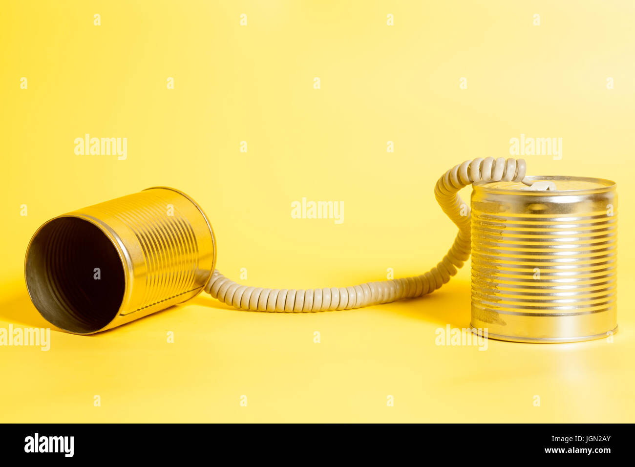 Tin can phone. Communication concept Stock Photo - Alamy