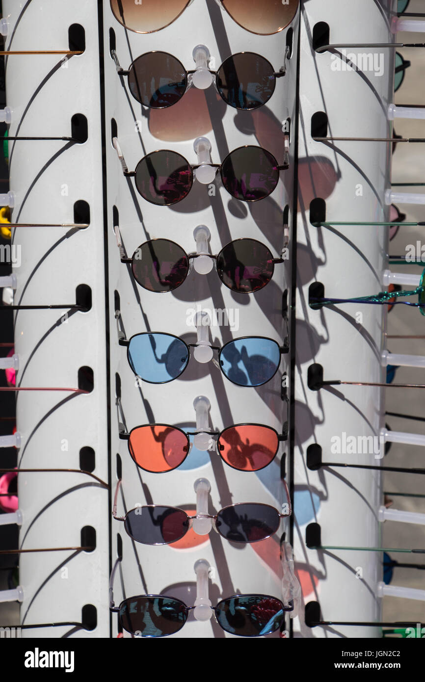 set of different colored glasses as a background Stock Photo - Alamy